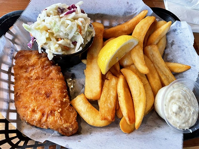 The fish and chips that launched a thousand ships. Golden-battered perfection with crispy fries and house-made slaw—simplicity that speaks volumes.
