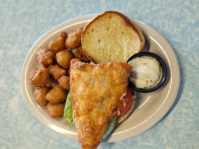 The fish sandwich that launched a thousand return trips. Those golden tater tots aren't just a side—they're little potato treasures worth the drive alone.
