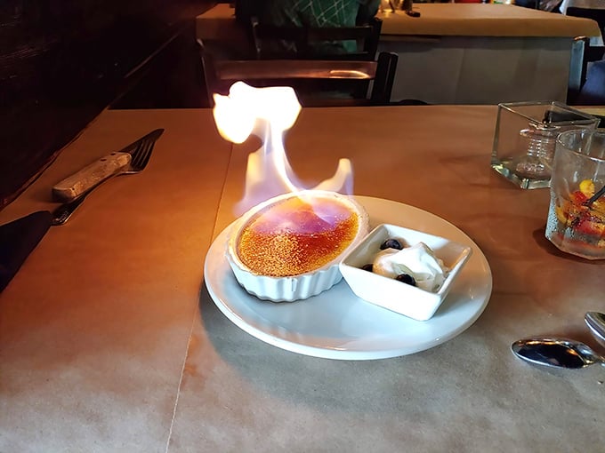 Nothing says "grand finale" quite like crème brûlée arriving with its own personal fireworks show.