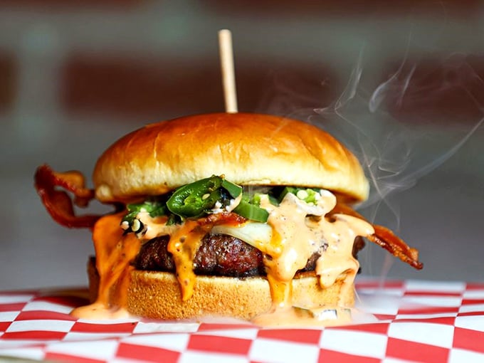 Steam rising from this masterpiece isn't smoke—it's applause. The melty cheese cascade is what burger dreams are made of.