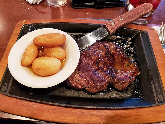 A steak that demands its own zip code. Those potatoes aren't just along for the ride—they're worthy companions on this flavor journey.