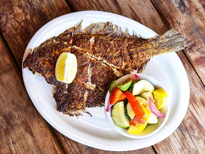 This isn't just flounder—it's a masterclass in fish preparation, with a golden crust that gives way to tender flakes and a splash of citrus brightness.