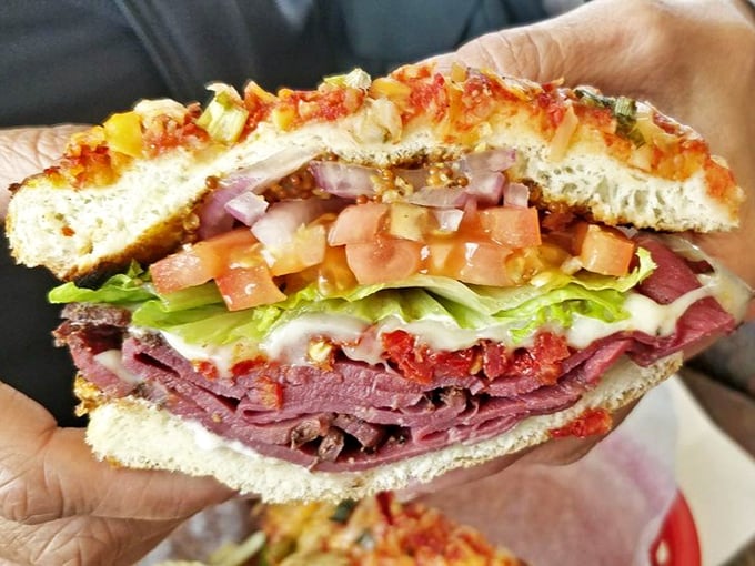 Layer upon glorious layer of deli perfection – this sandwich doesn't need fancy aioli or truffle oil to make its point, just honest ingredients done right.