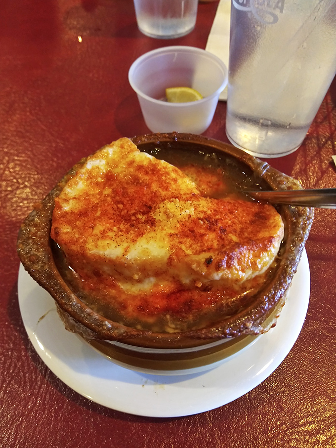 French onion soup that's achieved the perfect cheese-pull-to-broth ratio—the culinary equivalent of hitting the lottery on your first try.