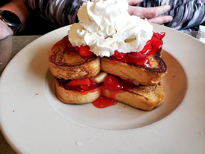 French toast that makes breakfast feel like dessert. Those strawberries and whipped cream aren't just toppings—they're a morning celebration.