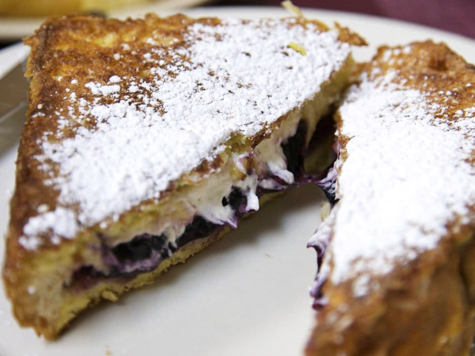 This isn't just French toast—it's a berry-stuffed masterpiece dusted with powdered sugar. Breakfast or dessert? The correct answer is "Yes."