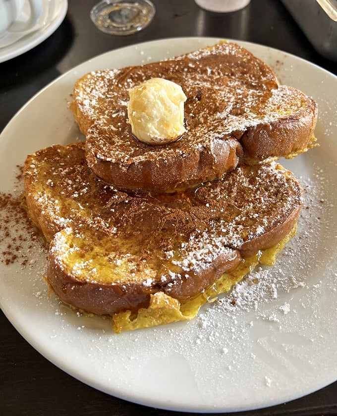 French toast that's achieved celebrity status in my breakfast fantasies—custardy interior, crisp edges, and that perfect butter crown.