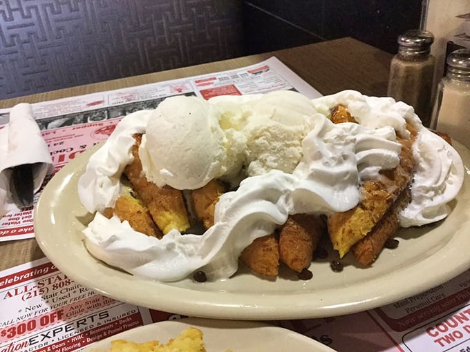 French toast that could make breakfast skeptics set multiple alarms. That mountain of whipped cream isn't just decoration—it's a lifestyle choice.