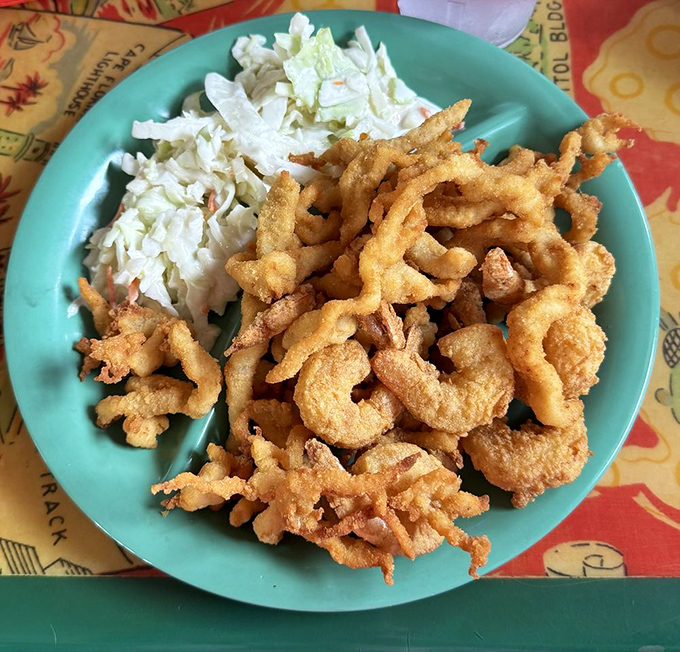 Fried clam strips and shrimp on those signature turquoise plates. Simple pleasures served with a side of coastal nostalgia.
