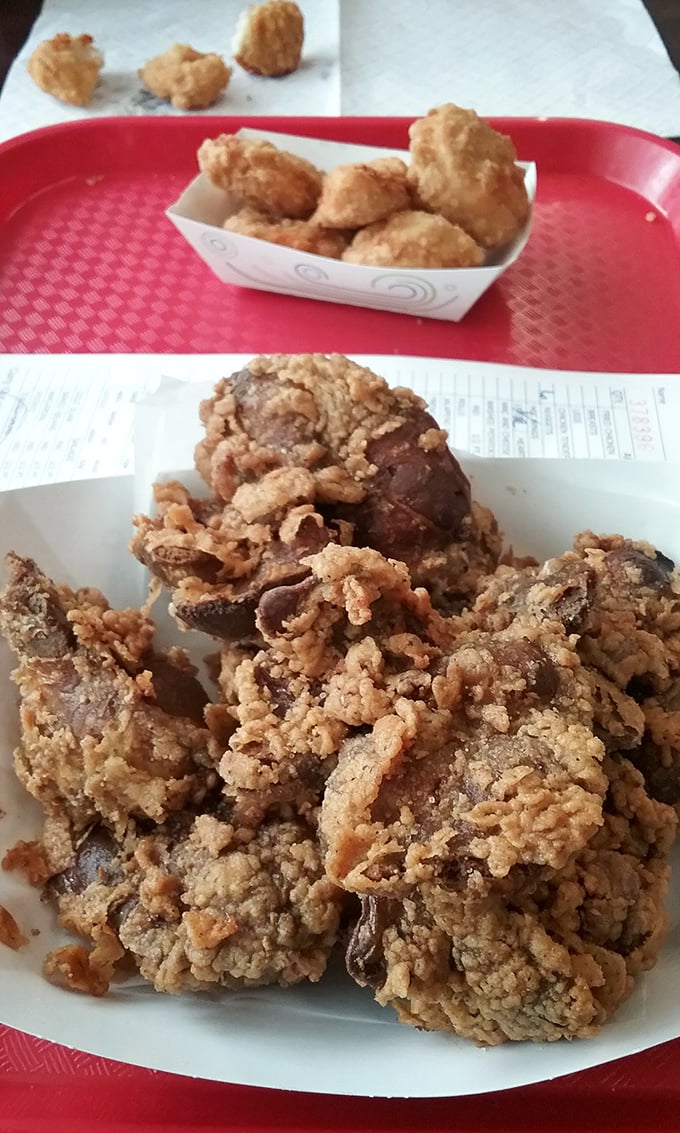 Crispy fried gizzards—the ultimate insider's order. These crunchy morsels are what separate the tourists from the true food adventurers.