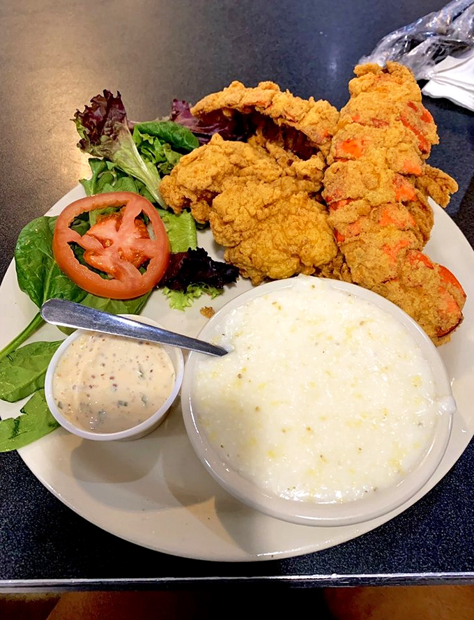 Golden-fried perfection meets creamy grits – a Southern duet that sings in perfect harmony on your taste buds.