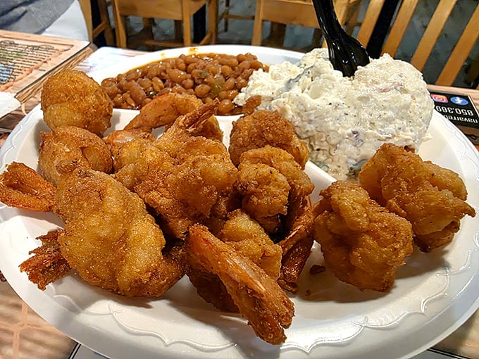 These fried shrimp aren't just golden—they're the Olympic gold medalists of the seafood world, accompanied by their faithful sidekicks: hushpuppies, beans, and coleslaw.