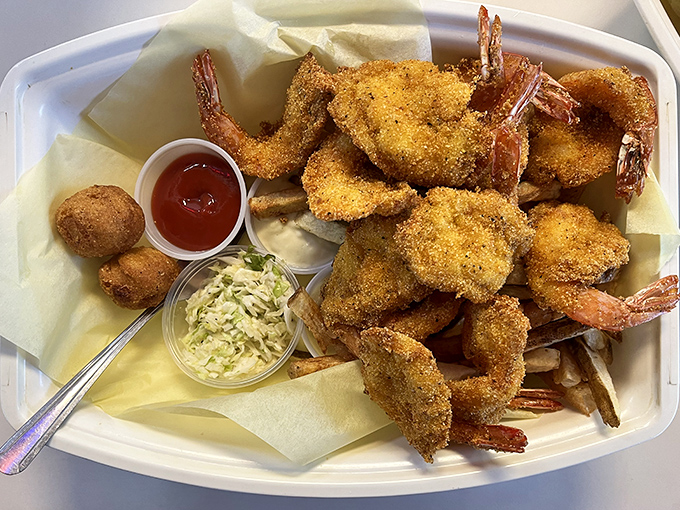 These cornmeal-crusted shrimp aren't just fried—they're transformed into crispy vessels of seafood perfection. The hushpuppy is just showing off.