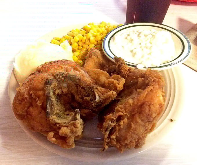 Golden-brown fried chicken that crackles with each bite, served with sides that know their supporting role perfectly.