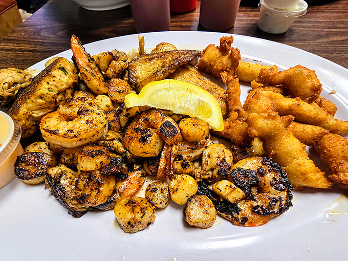 Blackened shrimp and fried fish share a plate in perfect harmony—like a culinary duet where both performers deserve a standing ovation.