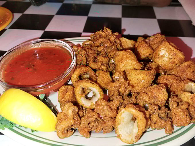 These golden-fried calamari aren't just appetizers, they're little crispy miracles from the sea. Perfectly seasoned and impossibly tender inside their crunchy armor.