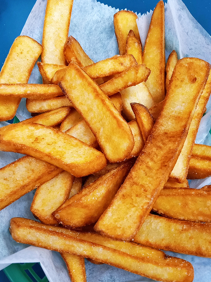 These aren't just fries—they're supporting actors that deserve their own Oscar, with a golden exterior that crackles like vinyl records and fluffy insides.