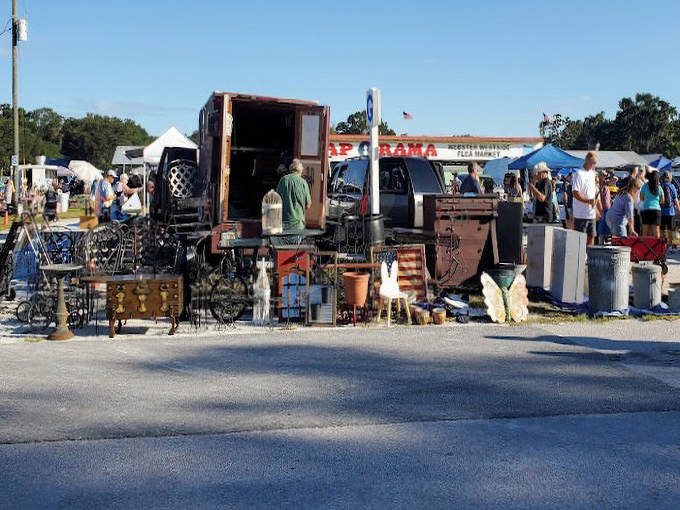 The outdoor vendor section—where furniture with character meets art with attitude. Your living room's missing piece is hiding here somewhere.