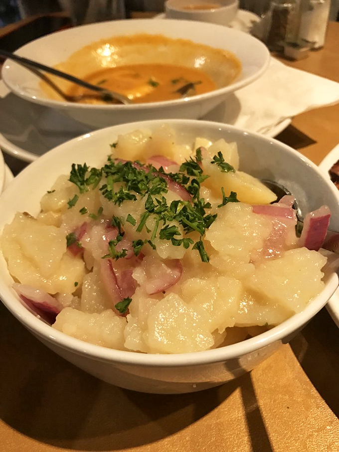 German potato salad that would make your Oma weep with joy—tender potatoes mingling with ham and fresh herbs in perfect harmony.
