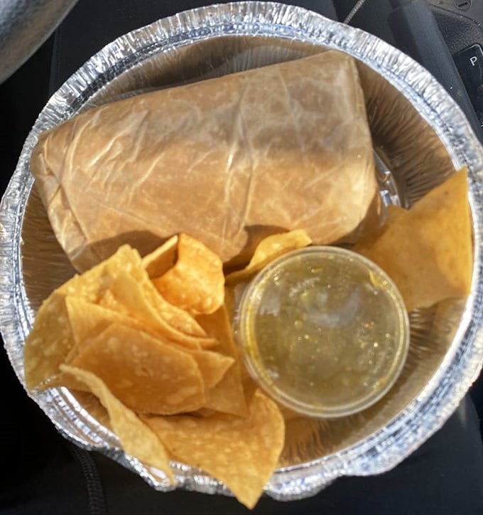 Chips, salsa, and a wrapped beauty – the holy trinity of Mexican comfort food presented in its most perfect form.