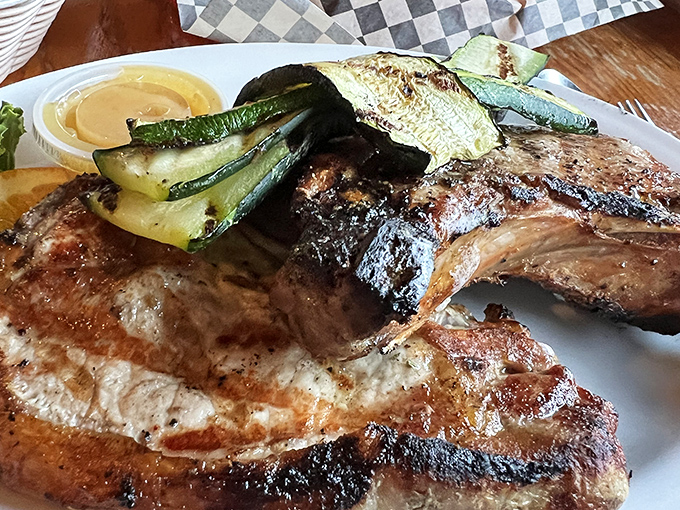 That pork chop has the kind of char that makes you want to write poetry. The grilled vegetables aren't just sidekicks—they're co-stars.