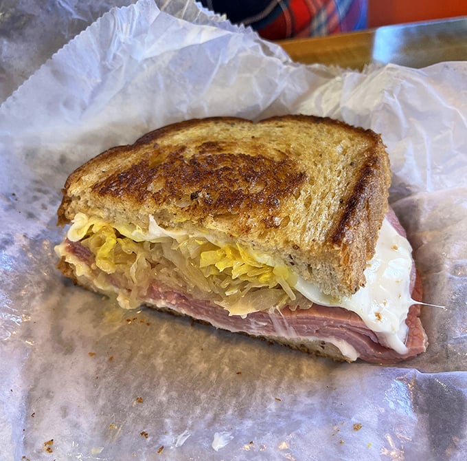 The grilled Reuben reveals Hot Dog World's hidden talent – perfectly toasted bread embracing that magical marriage of sauerkraut, meat, and melted cheese.