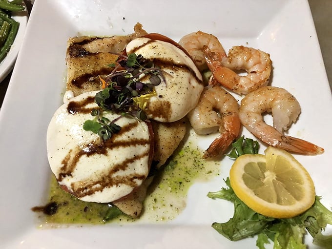 Fresh Gulf shrimp nestled alongside grilled grouper and fresh mozzarella—a coastal twist on caprese that makes you wonder why this isn't on menus everywhere.