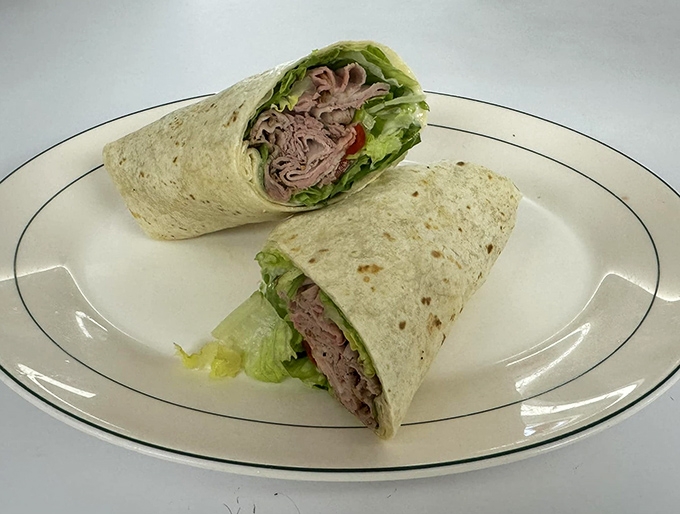 This isn't just a wrap – it's a perfectly executed gyro with tender meat, crisp lettuce, and fresh tomatoes that would make any Greek grandmother nod in approval.