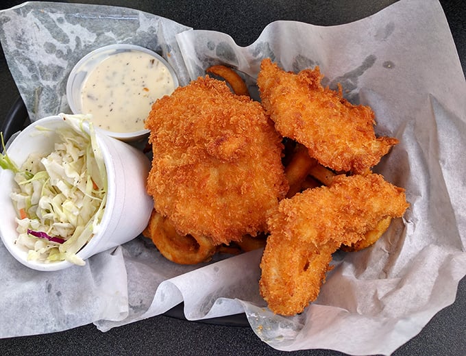 The halibut basket—where crispy exterior meets flaky interior in a marriage so perfect it should have its own reality show.