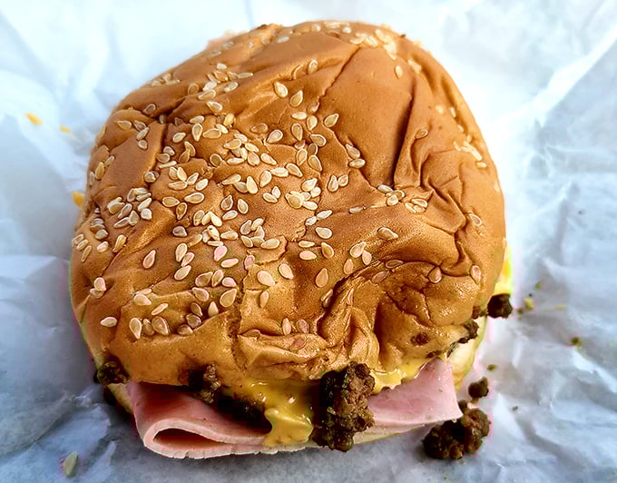 That sesame seed bun cradles ham and cheese like a edible love letter to your taste buds.