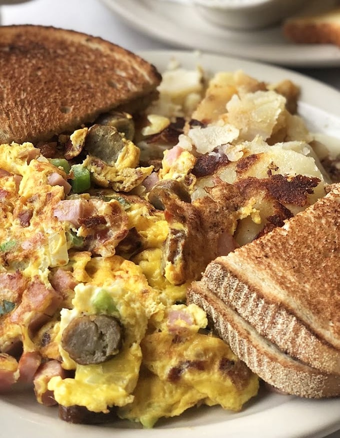 The Western omelet and home fries combo—where breakfast dreams come true and diet plans go to die.