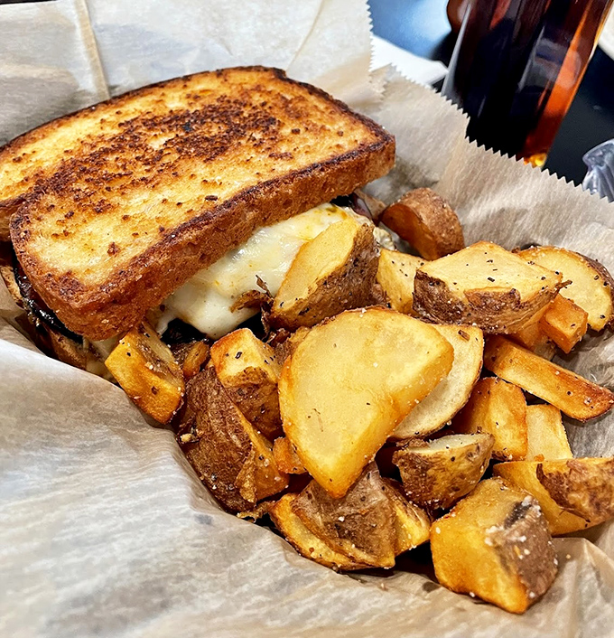The humble home fry—crispy on the outside, tender within—playing perfect wingman to a grilled cheese that means business.