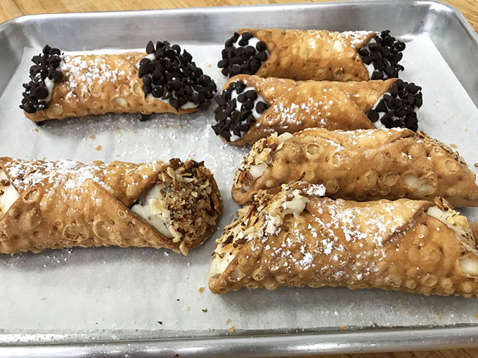 These cannoli don't play by the rules – crispy shells, creamy filling, and chocolate chips that make you forget every mediocre version you've ever had.