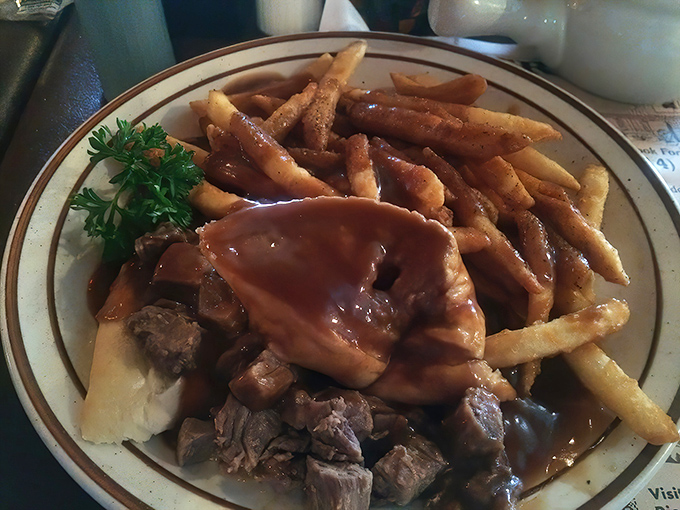 Hot roast beef with gravy-soaked fries—comfort food that hugs your insides like your grandmother after you've been away too long.