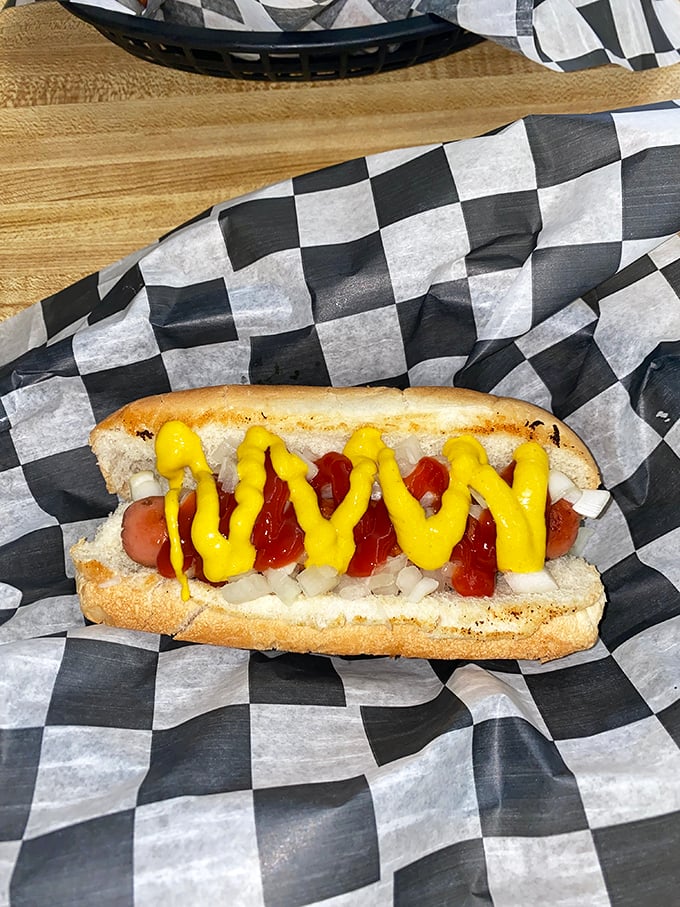 The hot dog comes dressed for success with mustard zigzags that would make Jackson Pollock proud. Simple perfection on a bun.