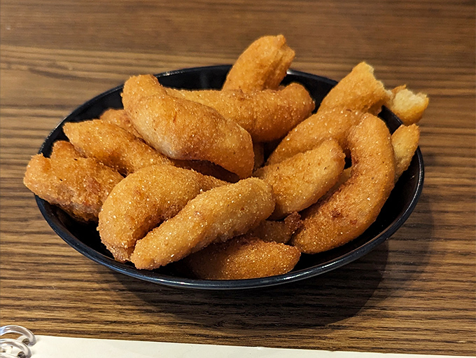 Golden-brown hush puppies that could make a Southerner weep with joy. Crispy outside, tender inside – the perfect seafood sidekick.