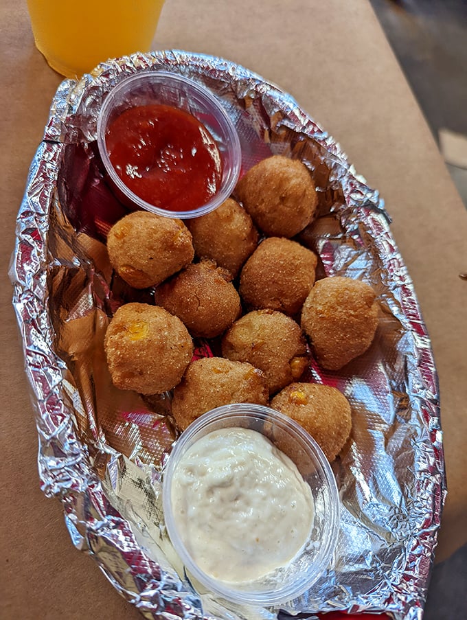Golden-fried hush puppies—those little cornmeal spheres of joy that somehow make waiting for your crabs feel like a reward, not a punishment.