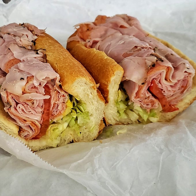 The Italian hoagie – architectural perfection between bread. Layers of thinly-sliced meat and crisp lettuce create the sandwich equivalent of the Sistine Chapel.