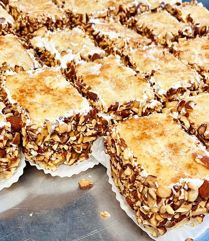 These rum cakes, edged with toasted almonds, aren't just desserts—they're celebrations waiting to happen. The perfect excuse to gather family around a table.