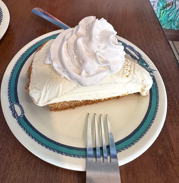 Key lime pie that strikes the perfect balance between sweet and tart—topped with a cloud of whipped cream that deserves its own weather report.
