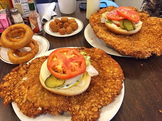 Not one but TWO tenderloins that require their own zip code, flanked by onion rings that could double as Olympic rings. This isn't a meal—it's a commitment.