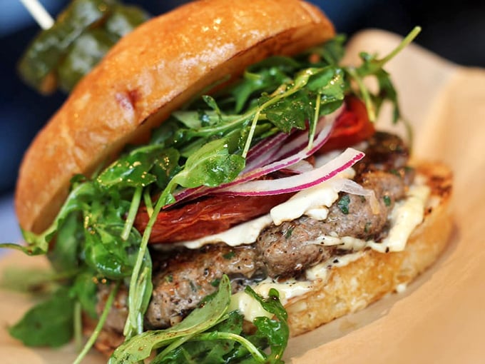 This Lamb Burger doesn't just break the rules—it rewrites them. Fresh arugula and roasted tomato create a Mediterranean symphony in West Sacramento.