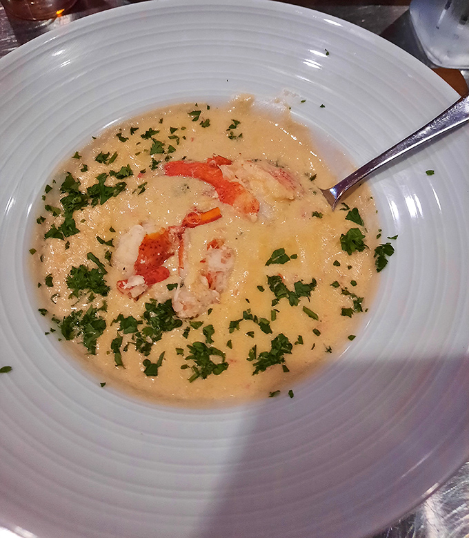 This lobster bisque isn't just soup, it's a creamy ocean vacation in a bowl. Those chunks of lobster aren't hiding – they're showing off.