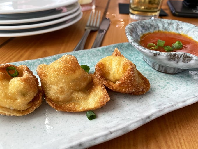Lobster Rangoon: Where East meets Key West. These golden pockets deliver a cross-cultural seafood revelation that would make Marco Polo jealous.