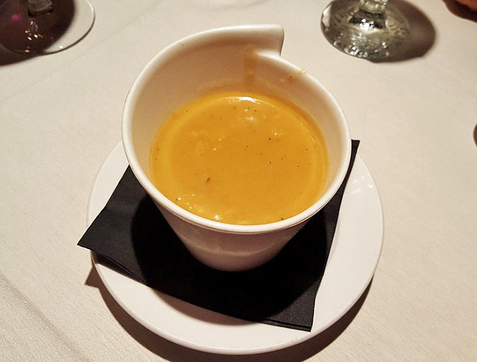 This lobster bisque isn't just soup—it's liquid luxury. Velvety, rich, and the kind of orange that signals delicious danger ahead.