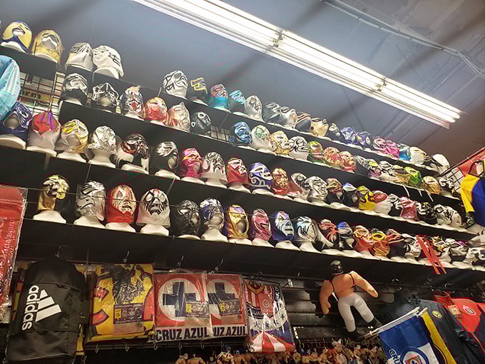 Lucha Libre masks line the walls like silent superheroes, each one holding stories of legendary battles and cultural pride.