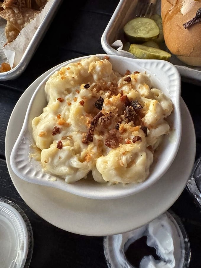 Mac and cheese that makes adults fight over the last bite. This isn't your childhood boxed version—it's a grown-up indulgence with toasted breadcrumbs that deserve their own fan club.