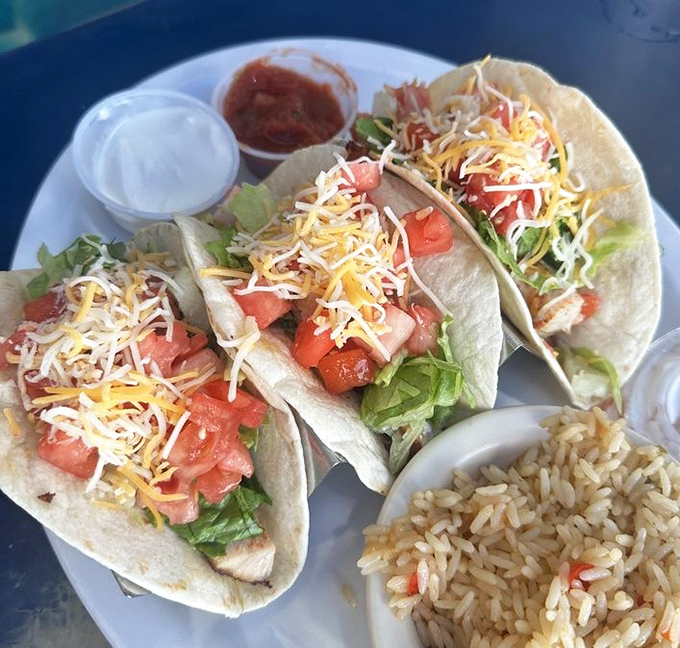 These fish tacos aren't just lunch—they're a vacation on a plate, complete with fresh salsa and Spanish rice that'll transport you straight to the tropics.