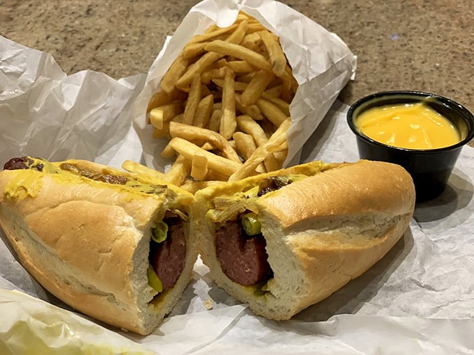 The Maxwell Polish in its natural habitat – mustard, grilled onions, and sport peppers creating a holy trinity of Chicago street food excellence.