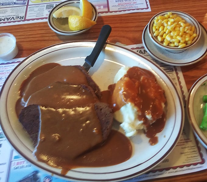 Meatloaf and mashed potatoes – the dynamic duo of diner cuisine. That gravy river should have its own national park designation.